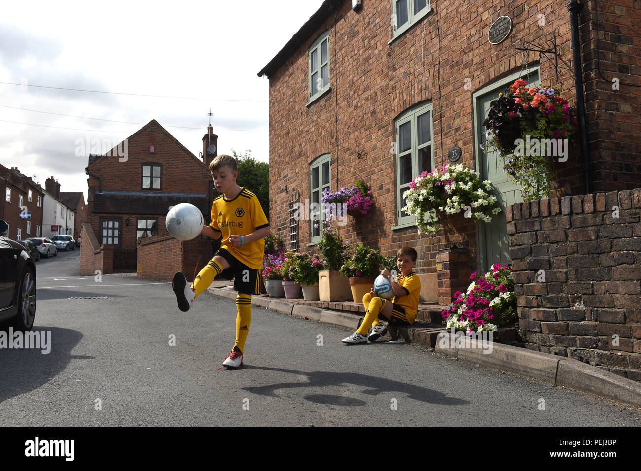 Boys in Wolverhampton Wanderers FC replica kits playing football ...