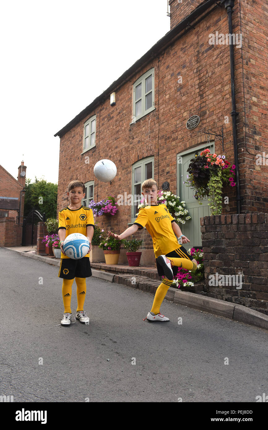 Boys in Wolverhampton Wanderers FC replica kits playing football ...