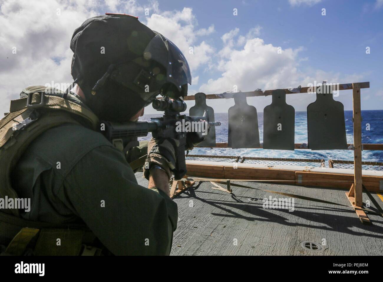 PACIFIC OCEAN (Dec. 2, 2015) U.S. Marine Capt. Andrew Behrends fires an ...