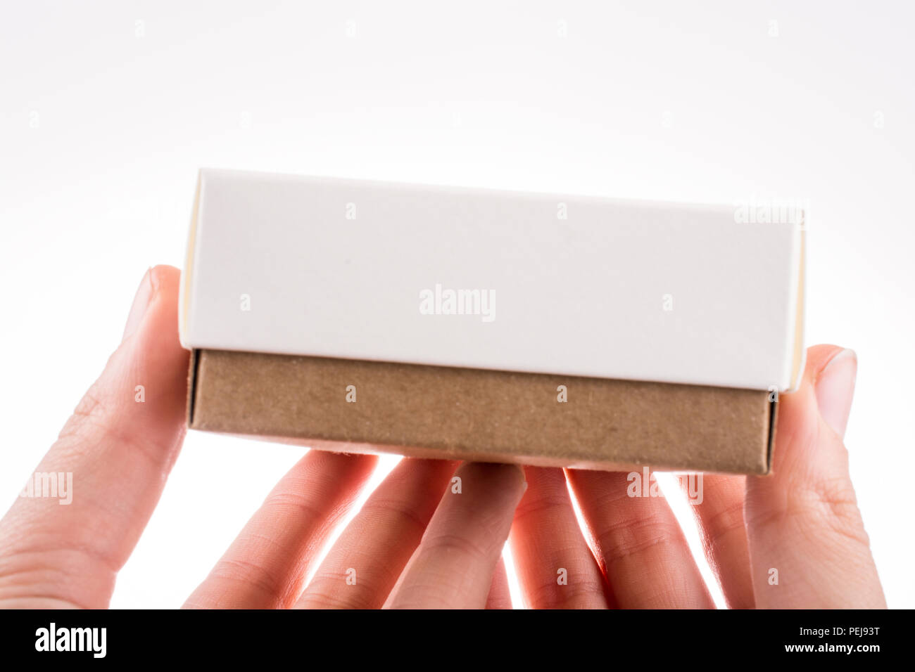 Hand holding cardboard Box on a white background Stock Photo - Alamy