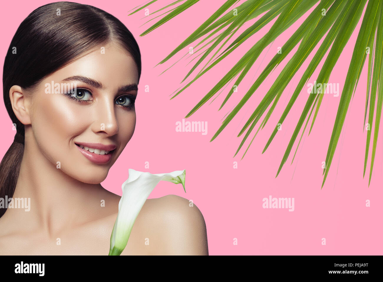 Spa model woman with green leaves and white flower. Spa beauty ...