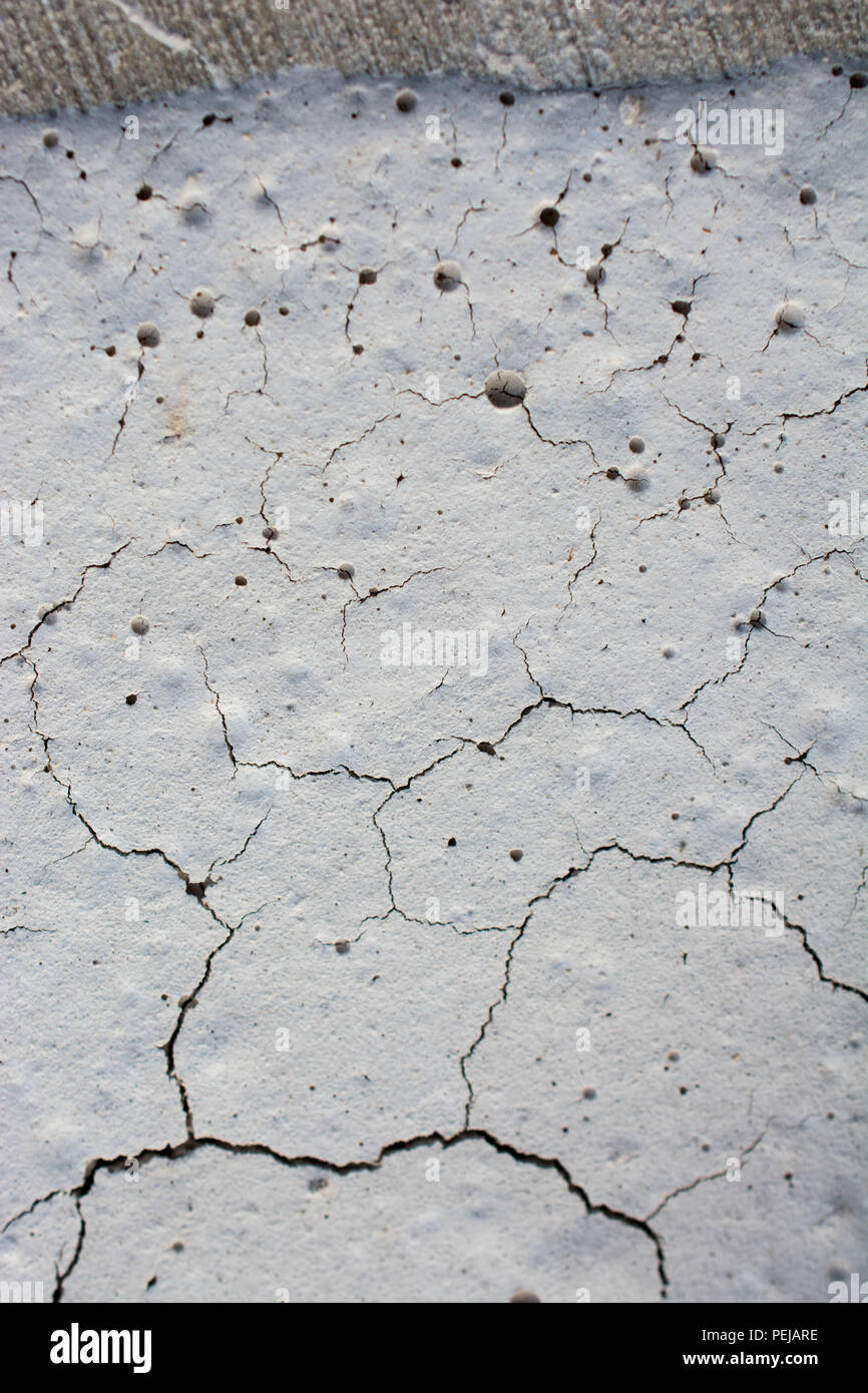 Grey color dry cracked muddy earth as a background texture Stock Photo ...