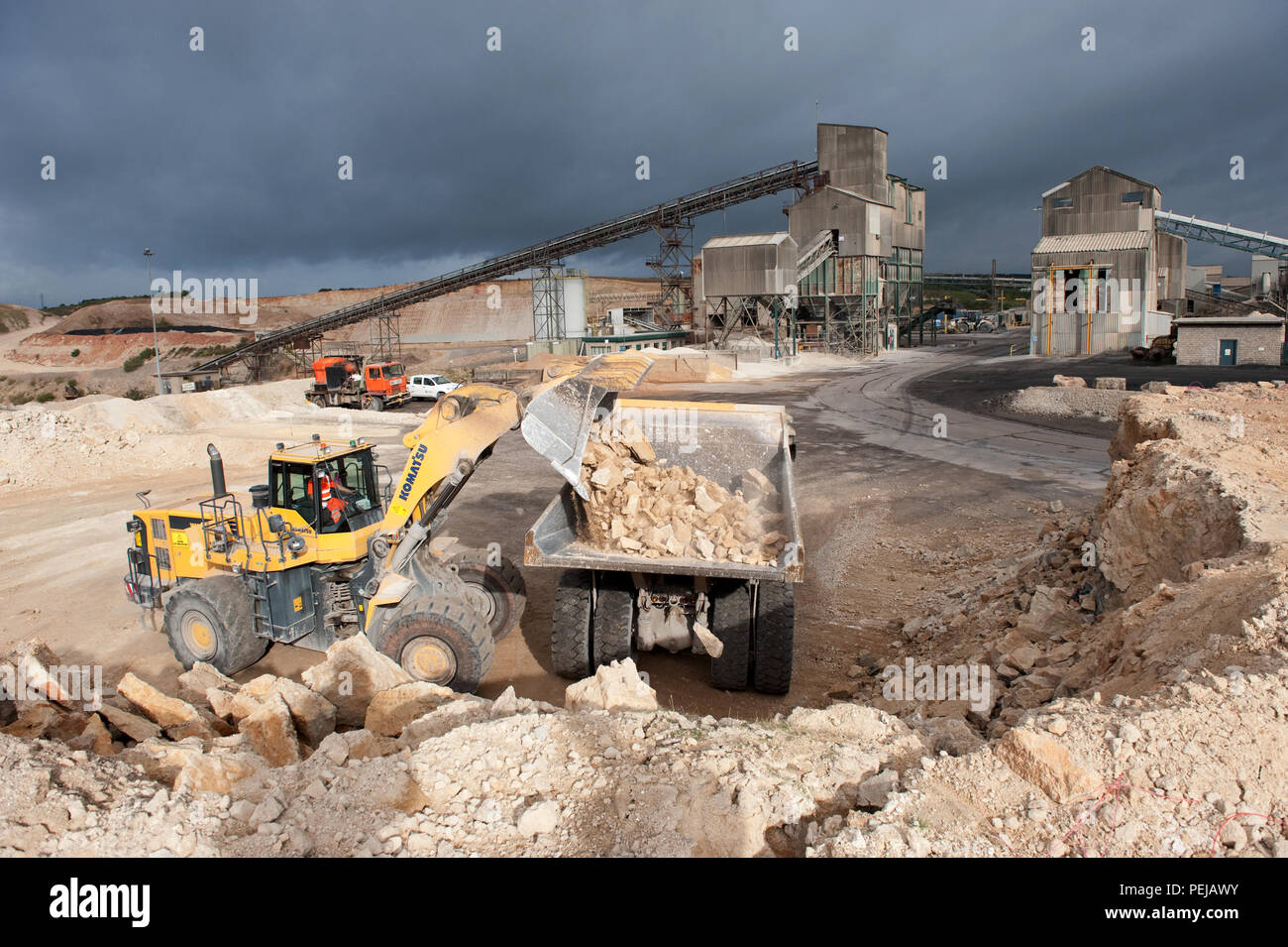 Excavator loading cement hi-res stock photography and images - Alamy