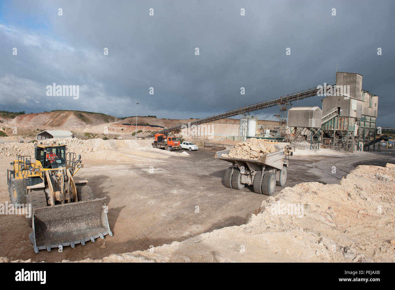 Excavator loading cement hi-res stock photography and images - Alamy