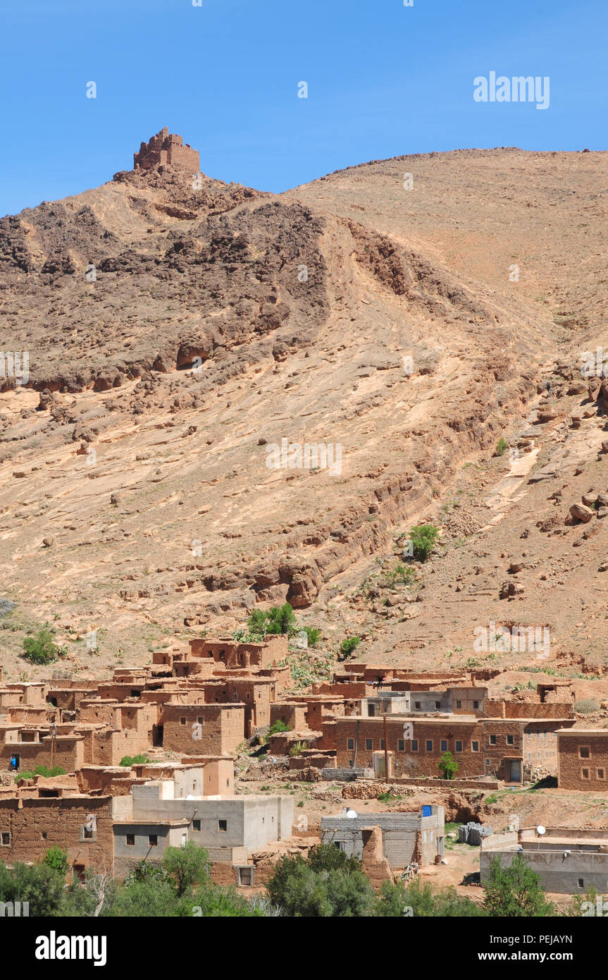 Moroccan village nestled in the spectacular geological scenery of the ...