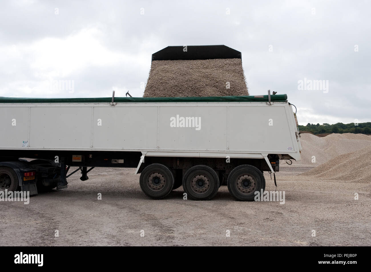 Fine aggregate is poured into a truck for distribution at Whitwell ...