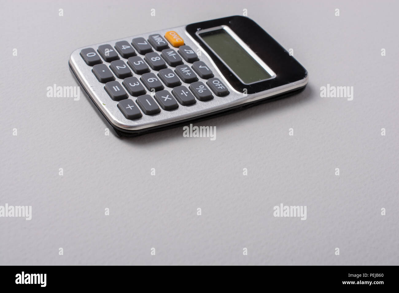Little size calculator placed on white background Stock Photo - Alamy