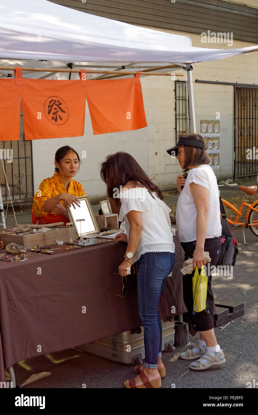 A Japanese Canadian woman wearing a kimono selling jewelry at the ...