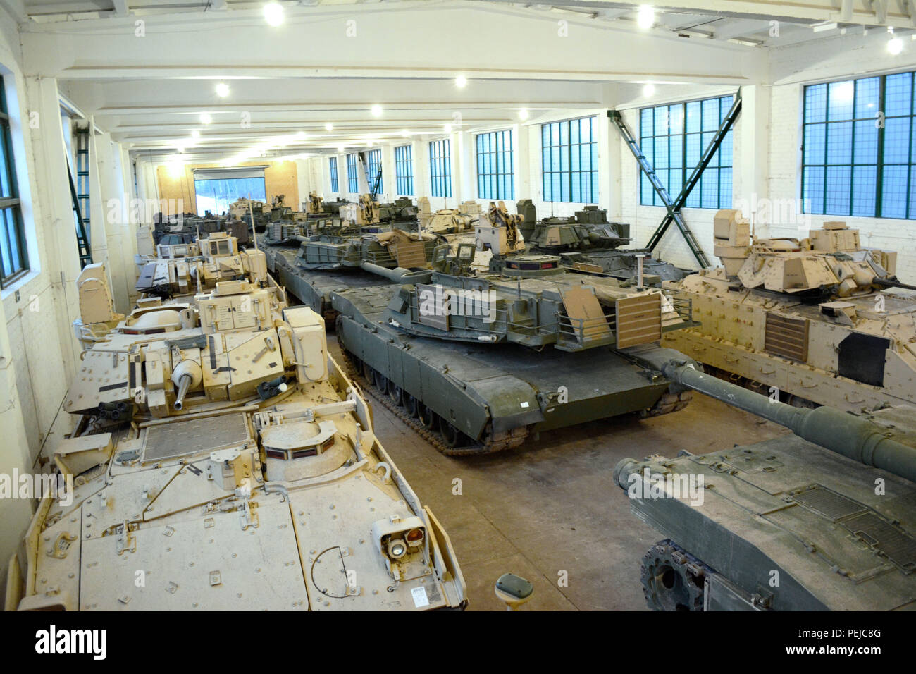 Abrams Main Battle Tanks and Bradley Fighting Vehicles are stored in a ...