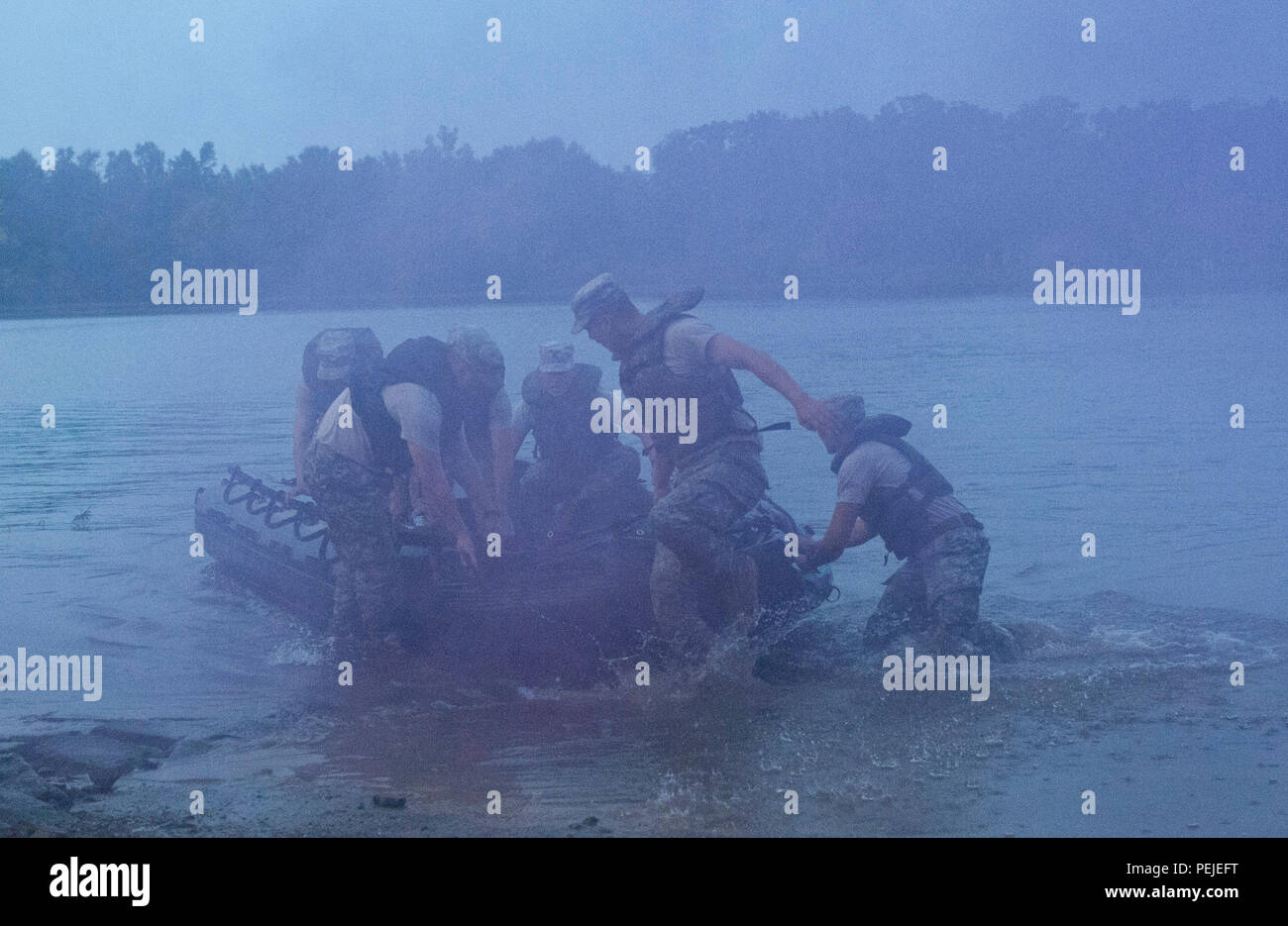 Soldiers competing in Sapper Stakes 2015, disembark a Zodiac boat to ...