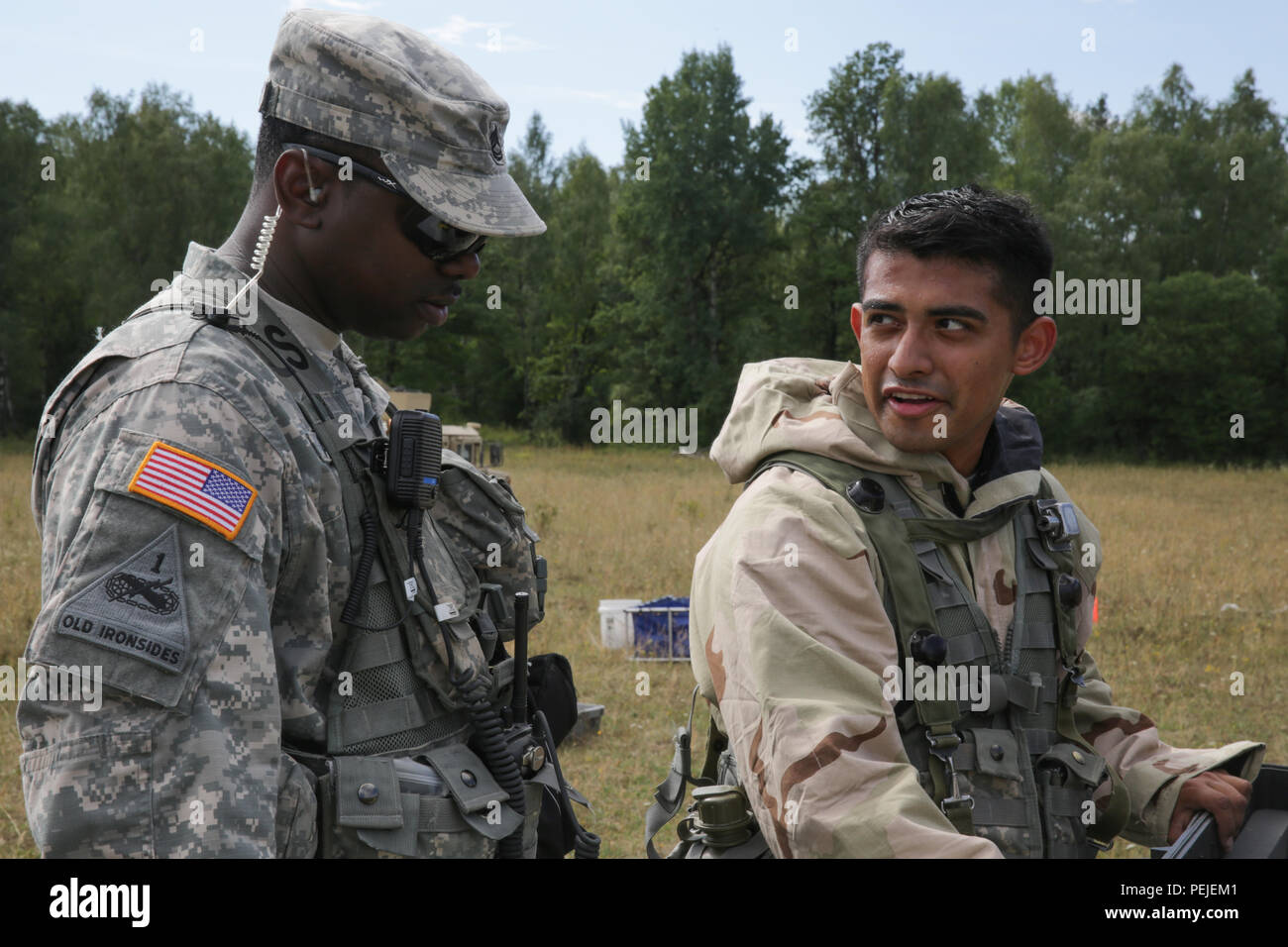 U.S. Army Sgt. Travis Hernandez, right, of Chemical Reconnaissance ...