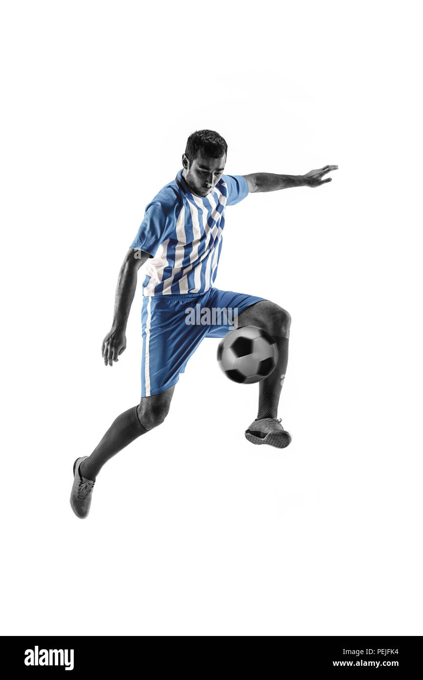 Professional football soccer player with ball isolated on white studio ...