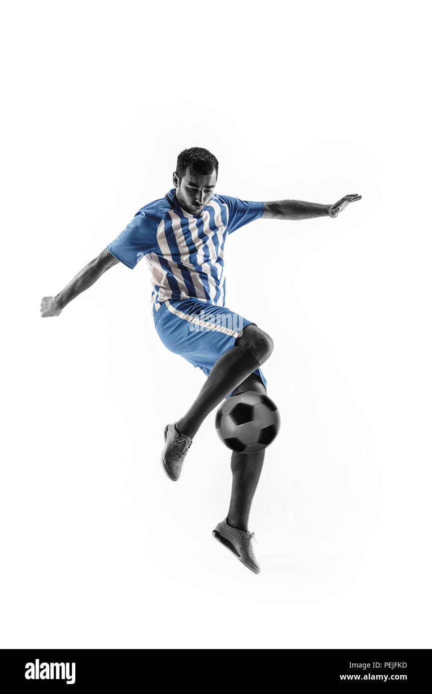 Professional football soccer player with ball isolated on white studio ...