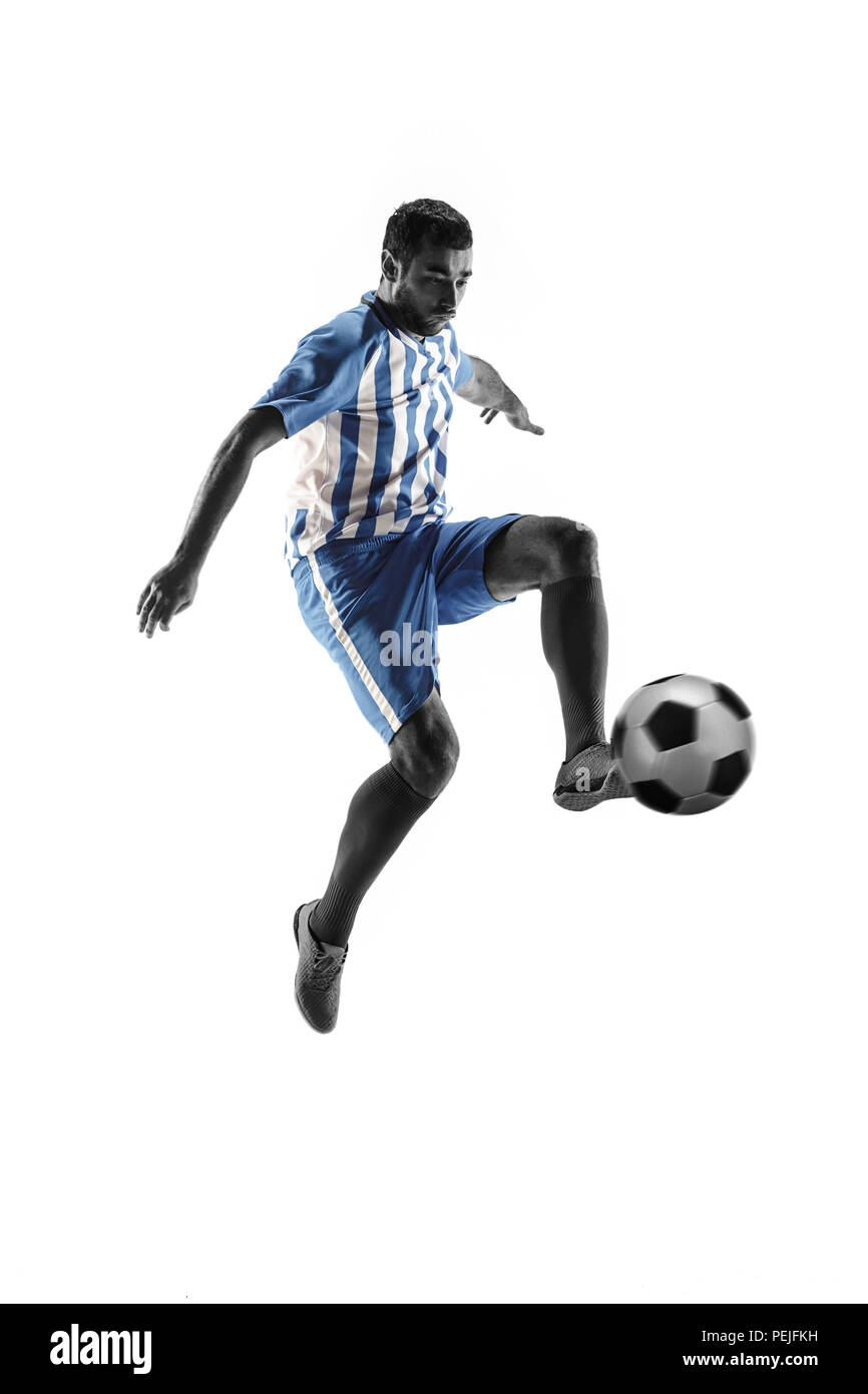 Professional football soccer player with ball isolated on white studio ...