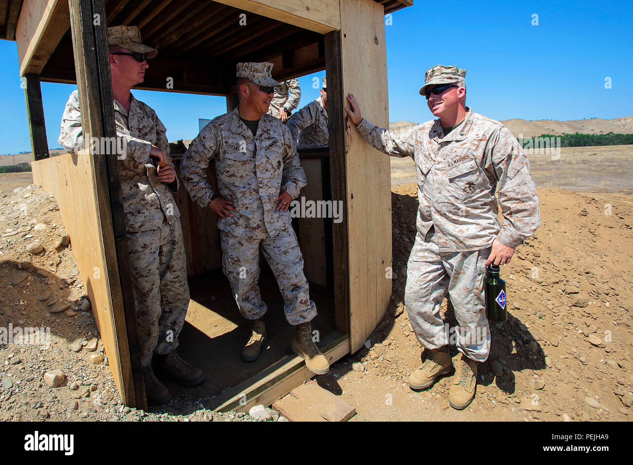 Capt. Robert Noxon (center), the commander of Company B, 1st Combat ...