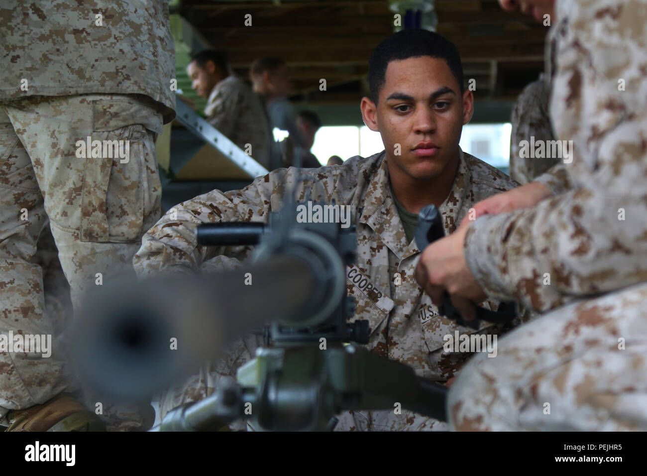 Cpl. Jevon Cooper receives a refresher class on a Browning M2 .50 ...