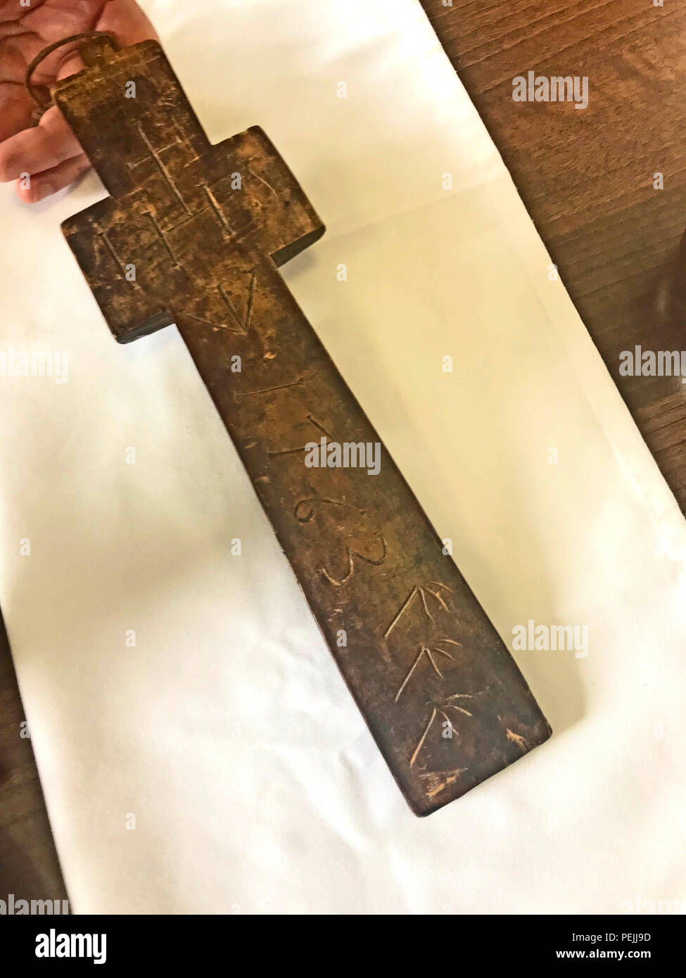 A cross dating back to Penal times inscribed with the date 1763. It ...