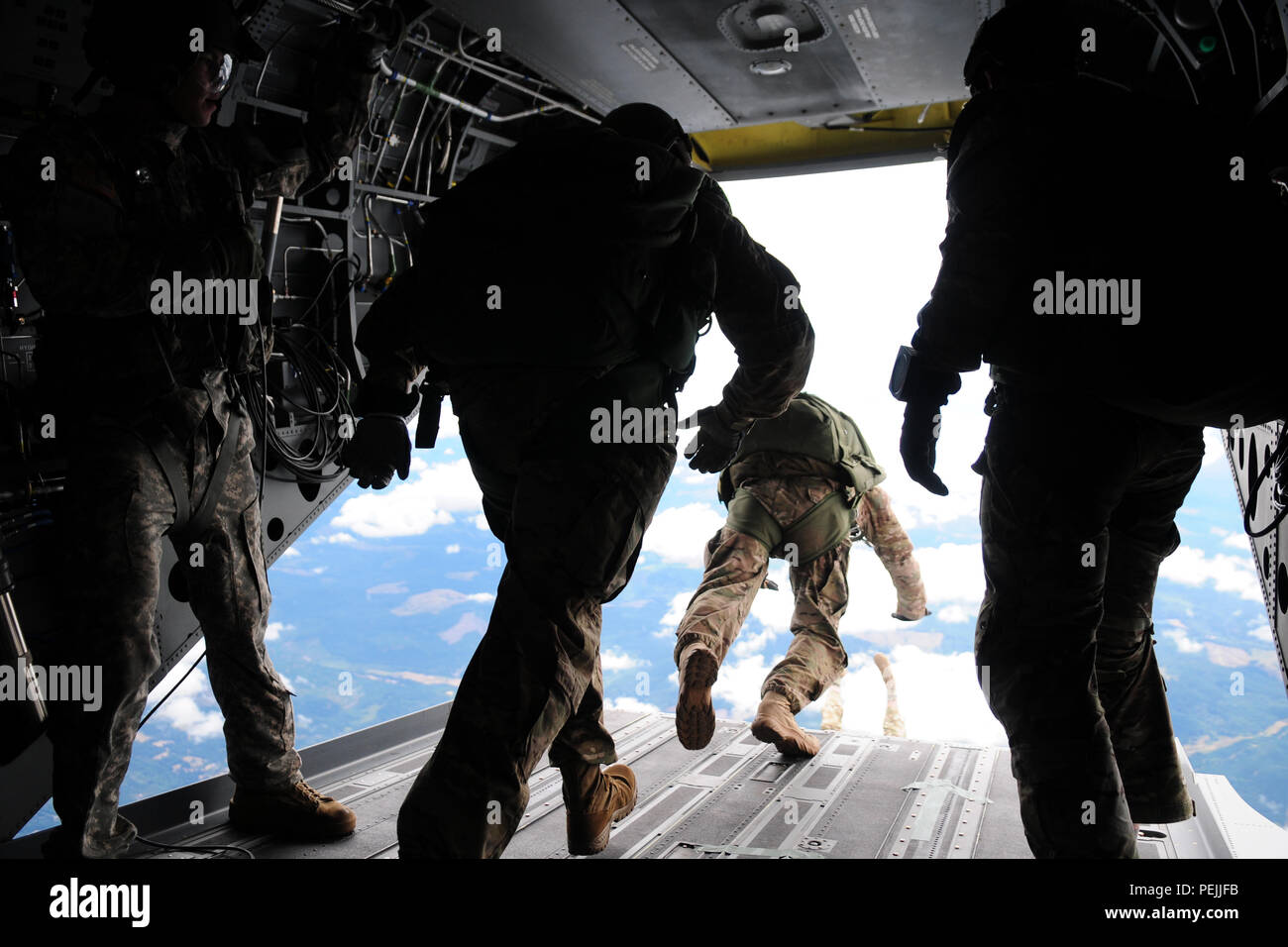 Guardsmen jump from a Chinook during Operation Husky Airborne Stock ...
