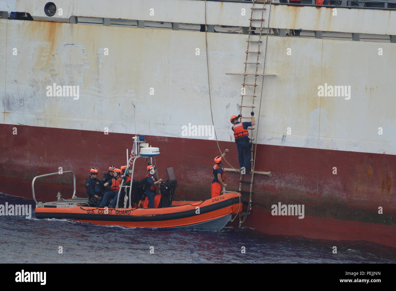 A Coast Guard Cutter Sequoia (WLB 215) boarding team along with an ...