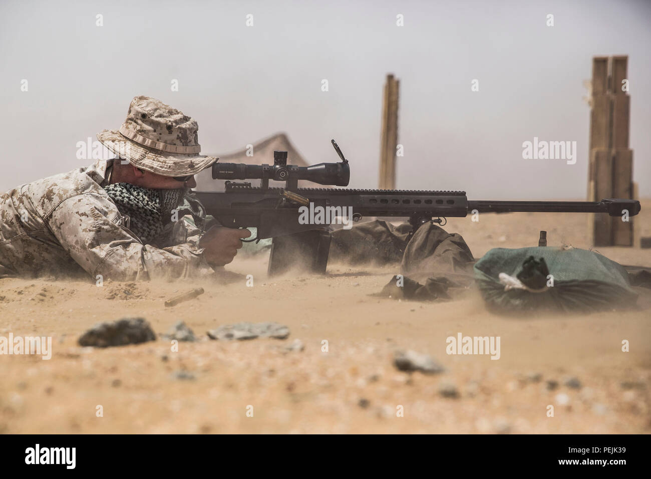KUWAIT (Aug. 30, 2015) U.S. Marine Cpl. Andrew Scott fires a special ...