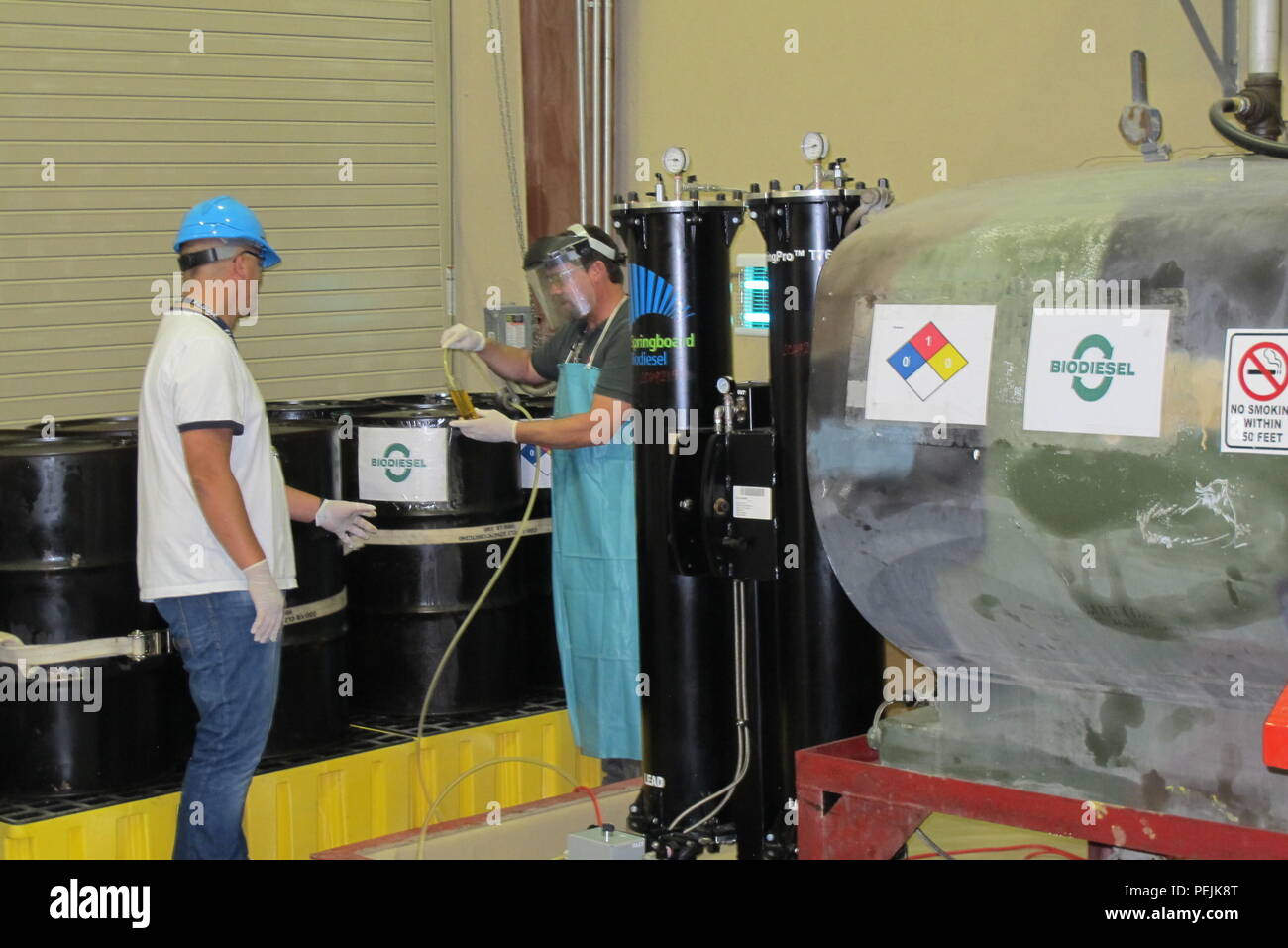Mahir Stilic, waste disposal technician, watches as Chris Waechter ...