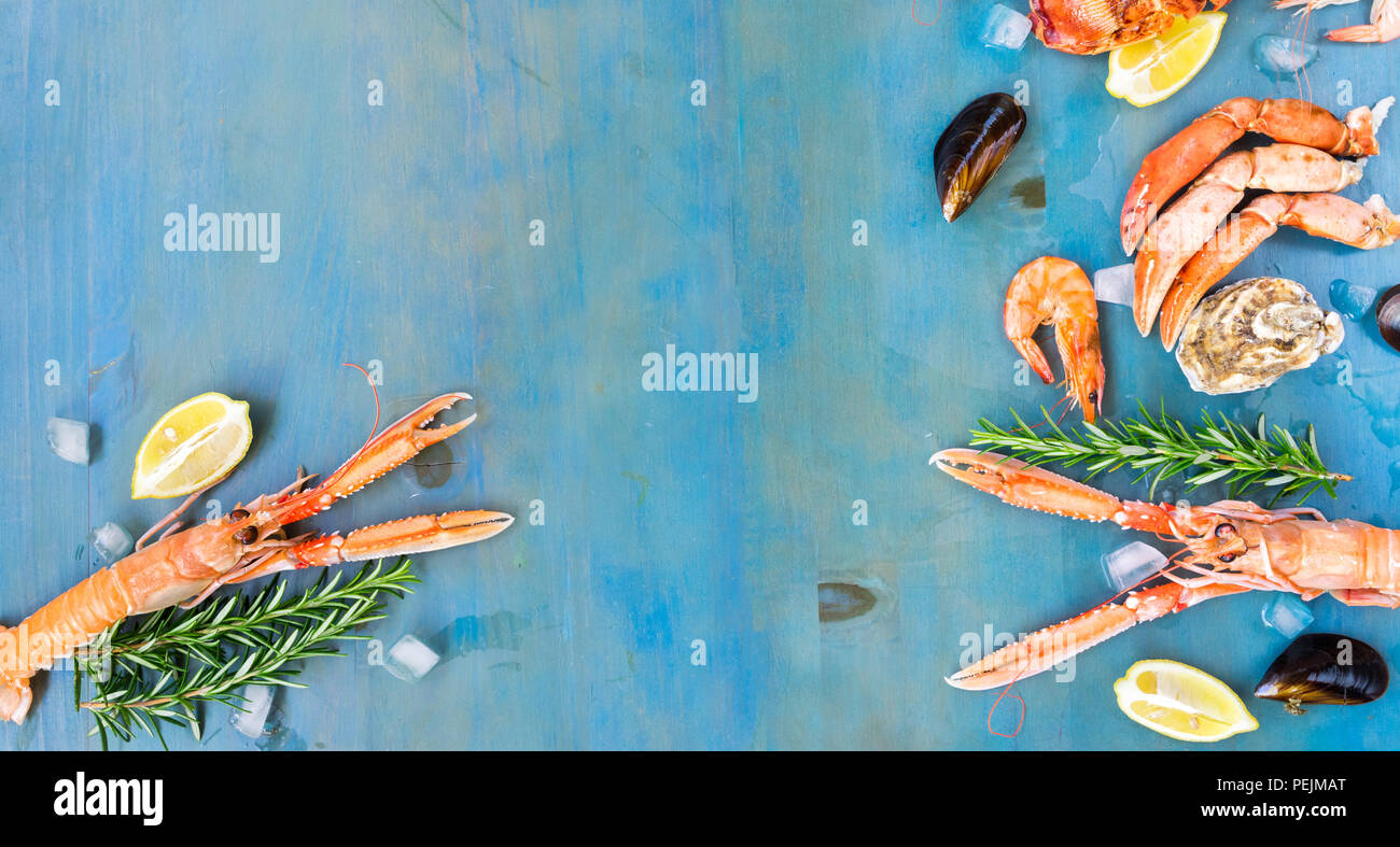 Fresh seafood on blue background Stock Photo - Alamy
