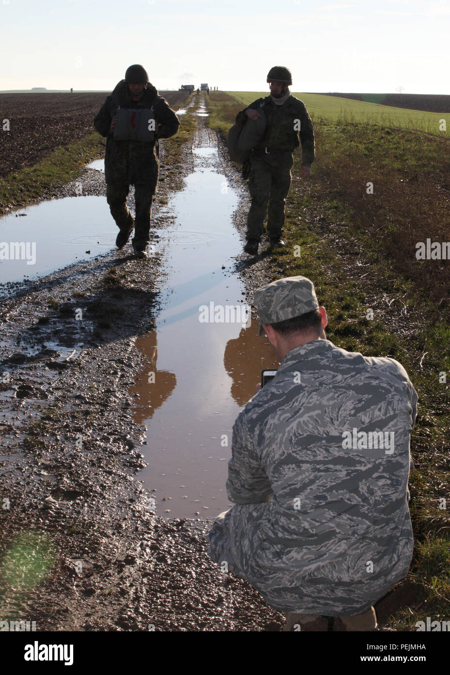 Staff Sgt. John Archiquette takes pictures of German paratroopers ...
