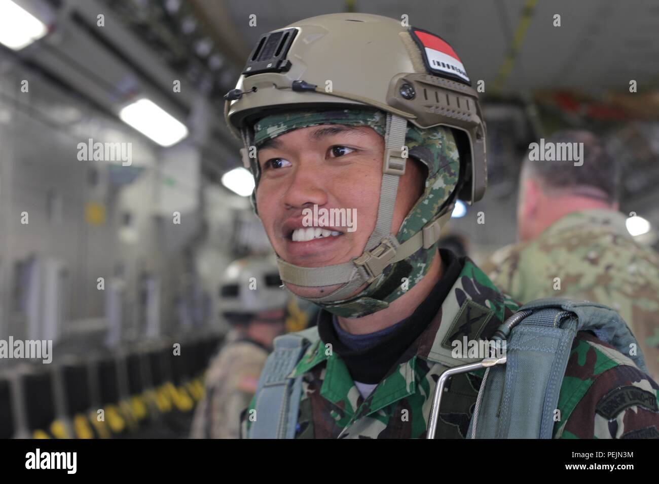 Indonesian Capt. Agung Dwi prepares to perform jumpmaster duties during ...
