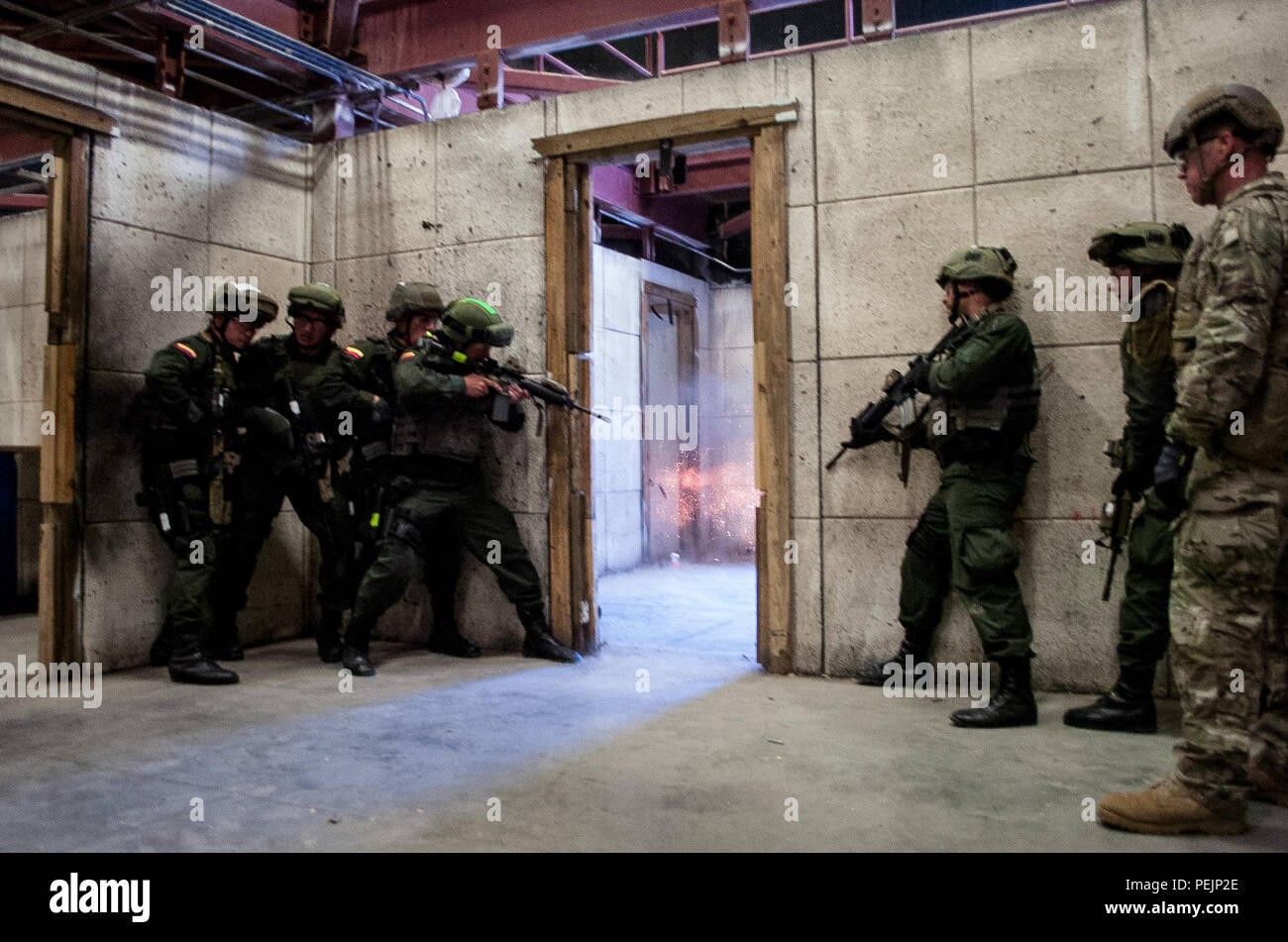 An explosive door-breaching charge detonates during a live-fire ...