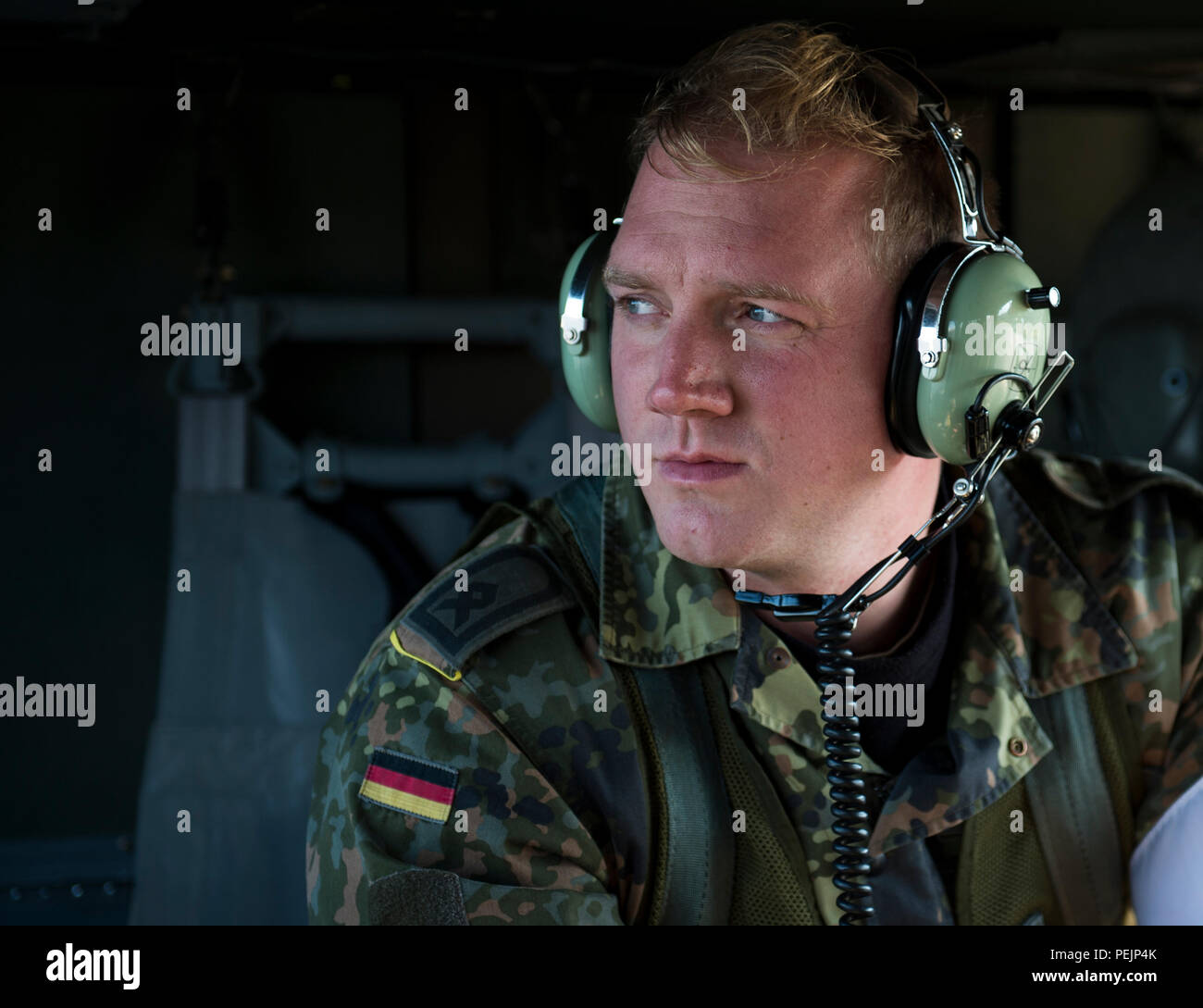 German Army Master Sgt. Alexander Reiter performs jumpmaster duties ...