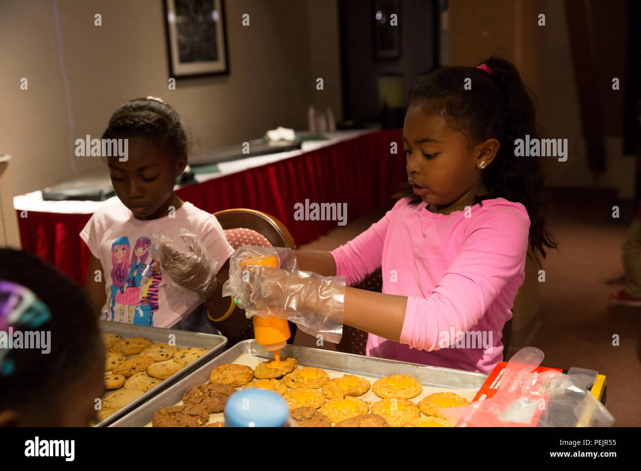 Lakahla McCoy, 8, daughter of Gunnery Sgt. Adrian McCoy, regimental ...