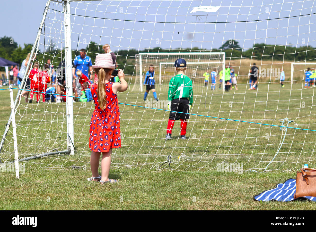 children playing football and playing in summer Stock Photo - Alamy