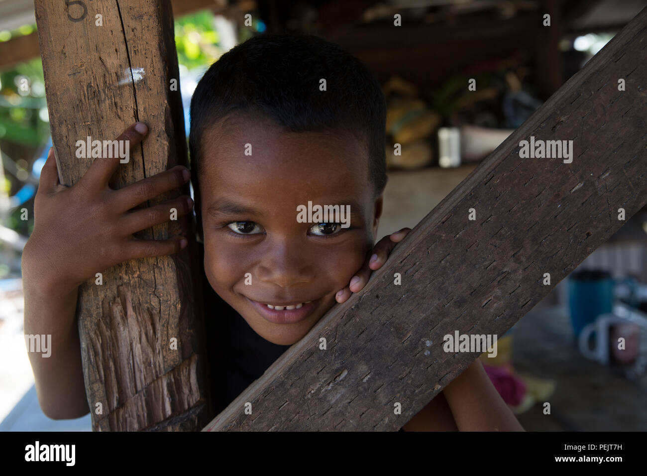 A boy shows a smile at an compound at Falalop Island, Ulithi Atoll ...