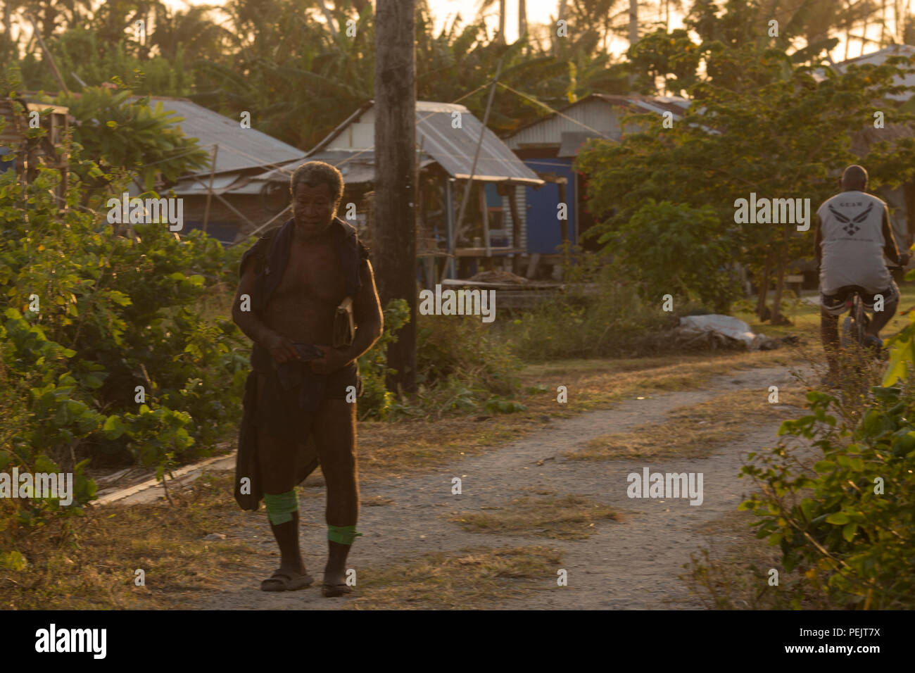 Andrew Ling walks back to home after working at Falalop Island, Ulithi ...