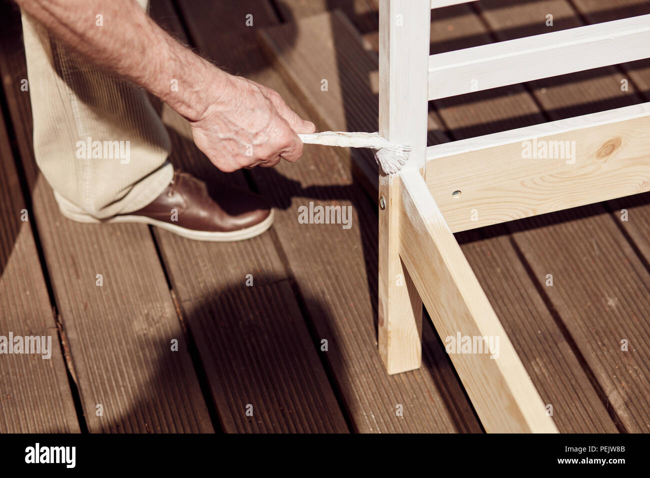 Old man paint his new bed on terrace Stock Photo - Alamy