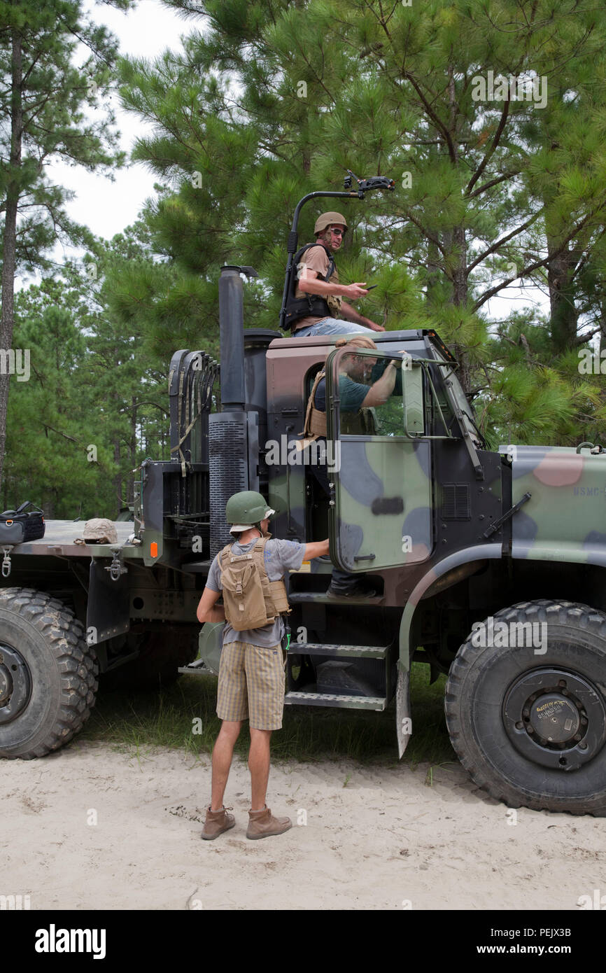 Staff from J. Walter Thompson Worldwide film and take photographs of U ...