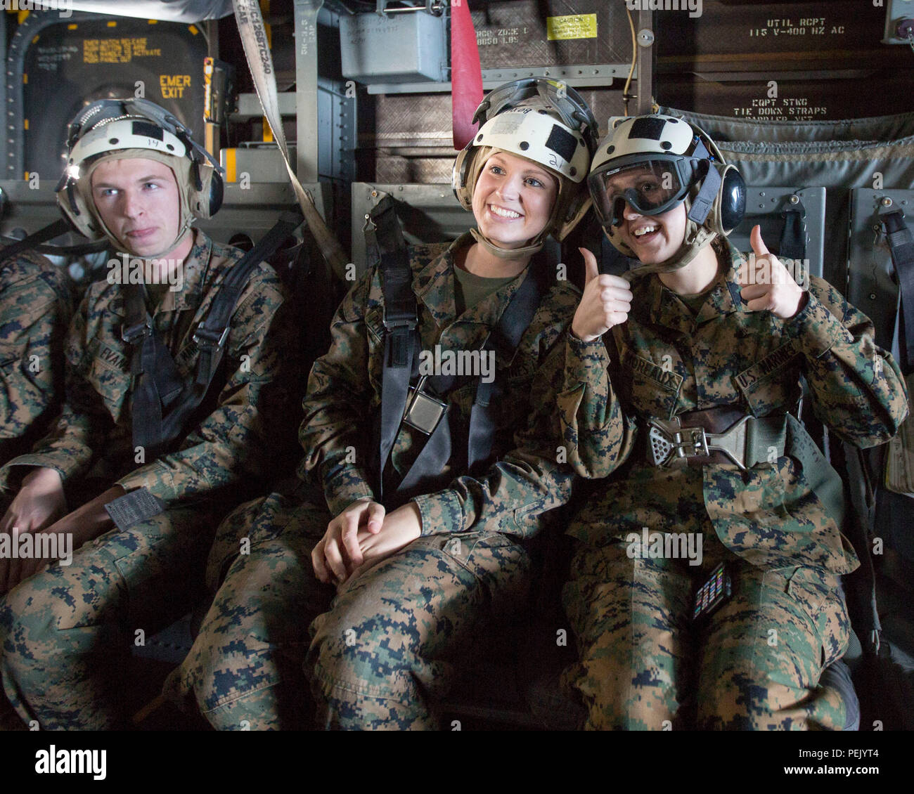 U.S. Marine Corps Sgt. Jazmine L. Moreaux, right, administrative ...