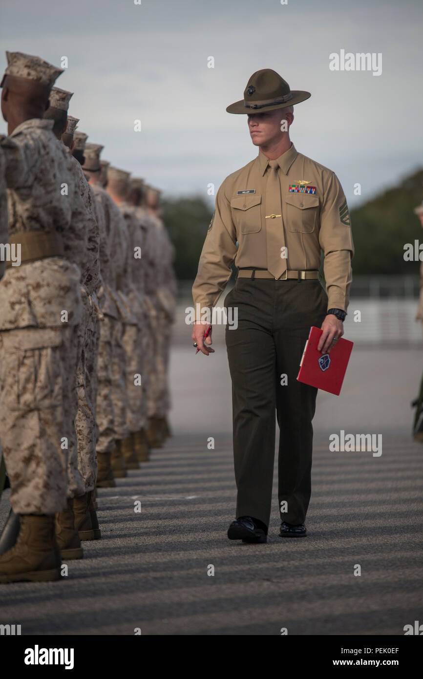 Staff Sgt. Dustin S. Miller, a Parris Island drillmaster, evaluates ...