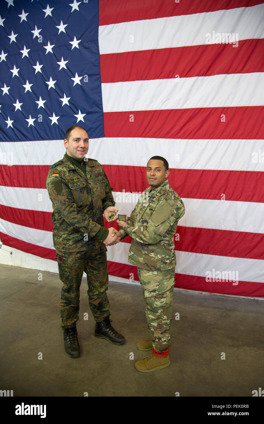 German Master Sgt. Markus Laut, jump master, left, and U.S. Army Staff ...