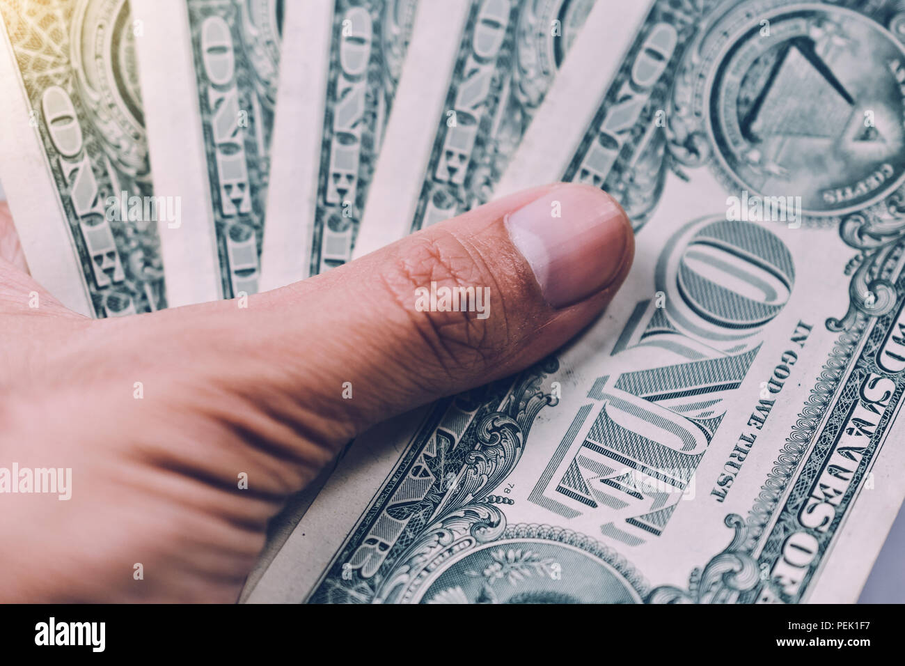 Hand holding dollar money,Investment and saving concept,One dollar ...