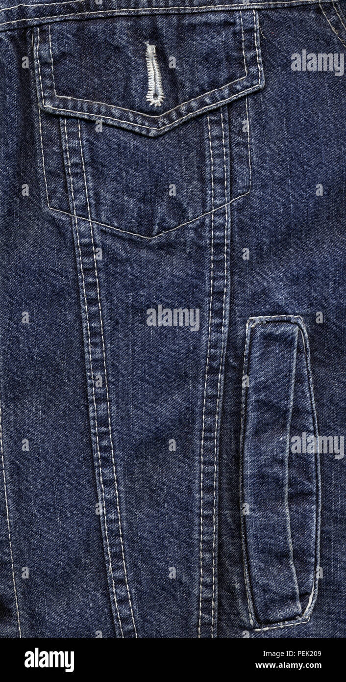 Detailed image of a denin jacket seeing pockets, texture and stitch ...