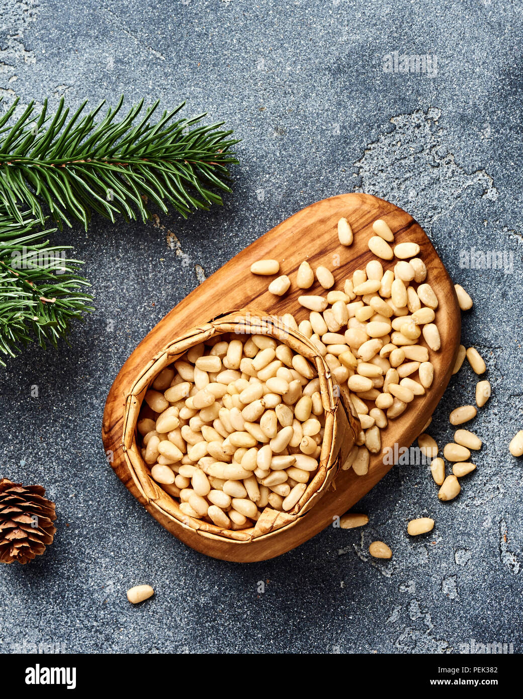 Peeled pine nuts on gray background. Top view Stock Photo - Alamy