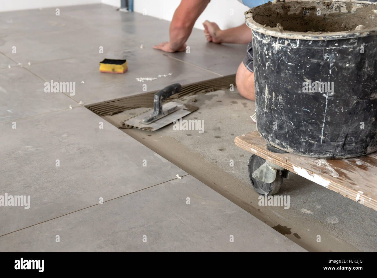 Ceramic tiles and tools for tiler. Floor tiles installation Stock Photo ...