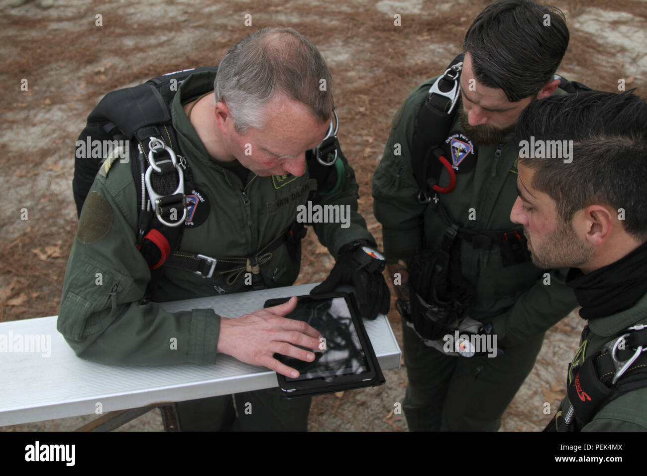 Dutch paratroopers discuss plans for a free fall jump during Operation ...