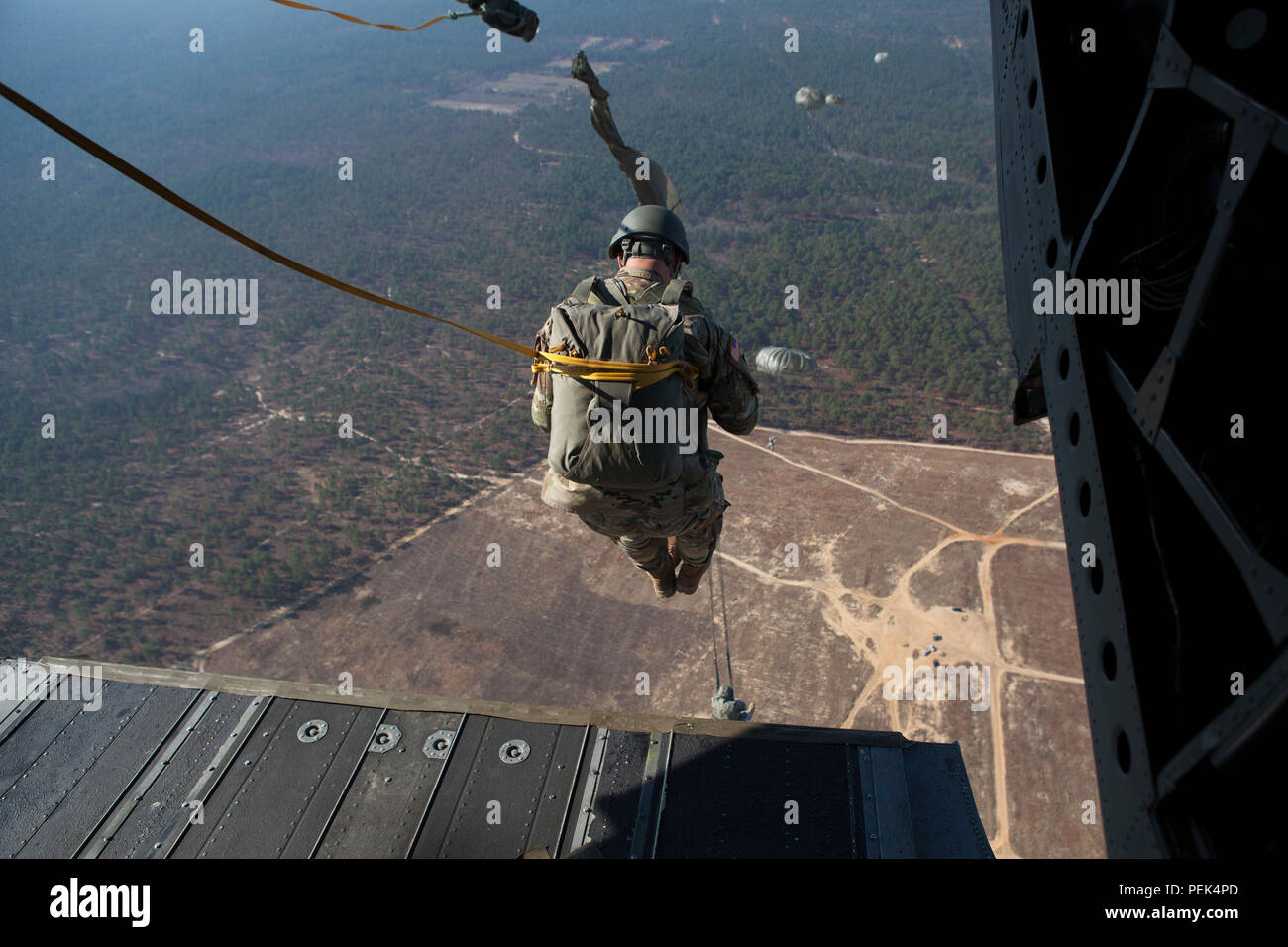 U.S. Army paratrooper exits a CH-47 aircraft for an airborne operation ...