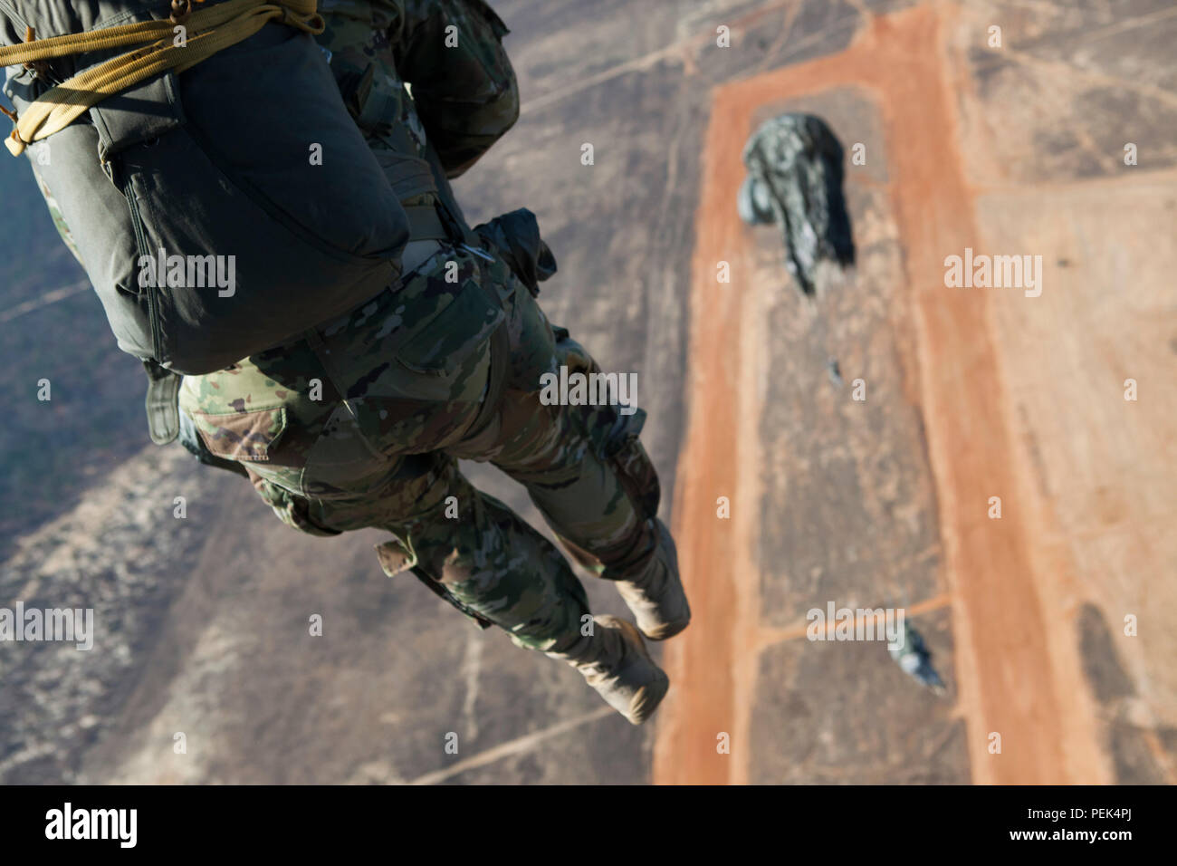 U.S. Army paratrooper exits a CH-47 aircraft for an airborne operation ...