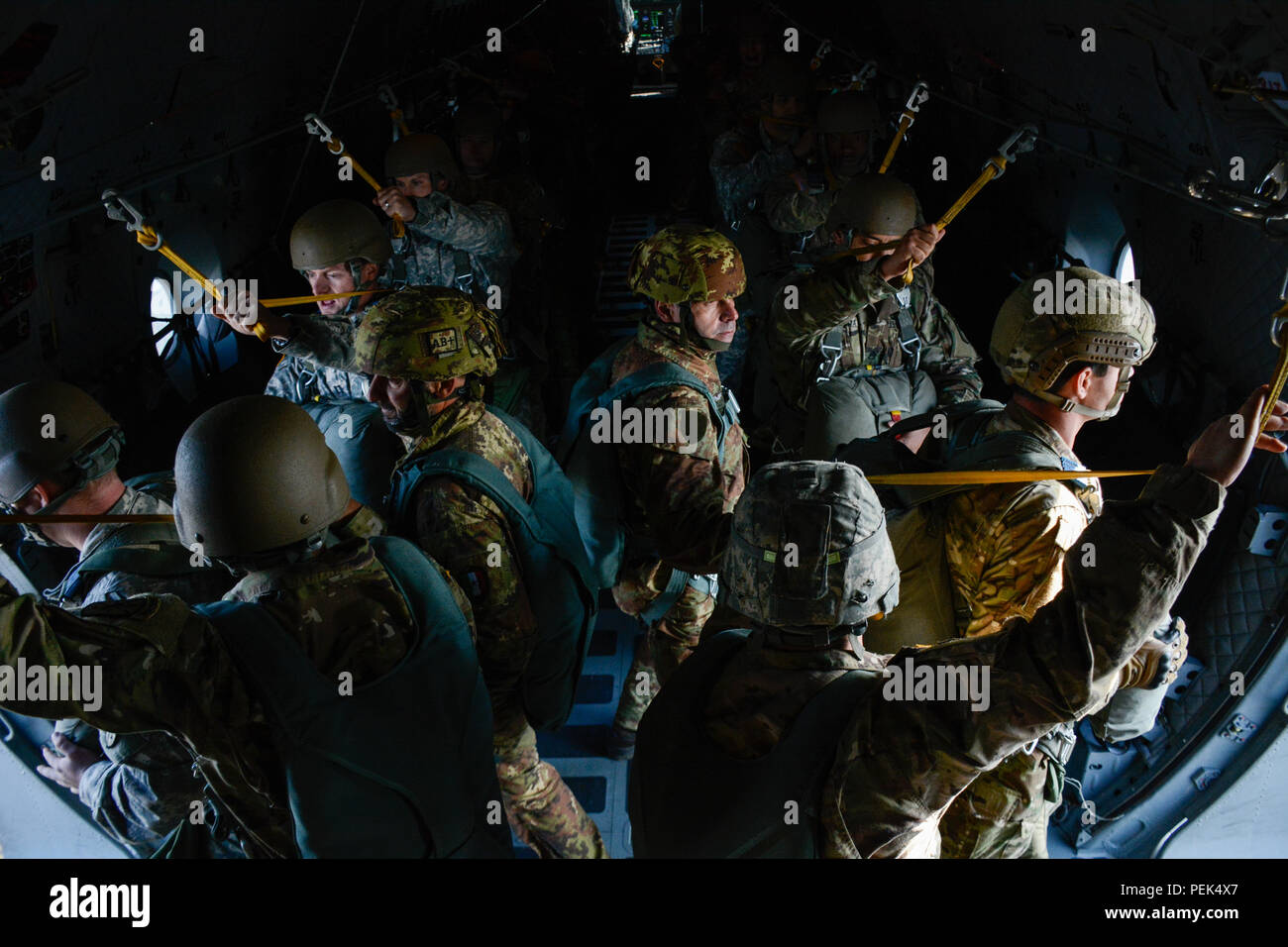 U.S. Army and Italian jumpmasters prepare U.S. airborne personnel to ...