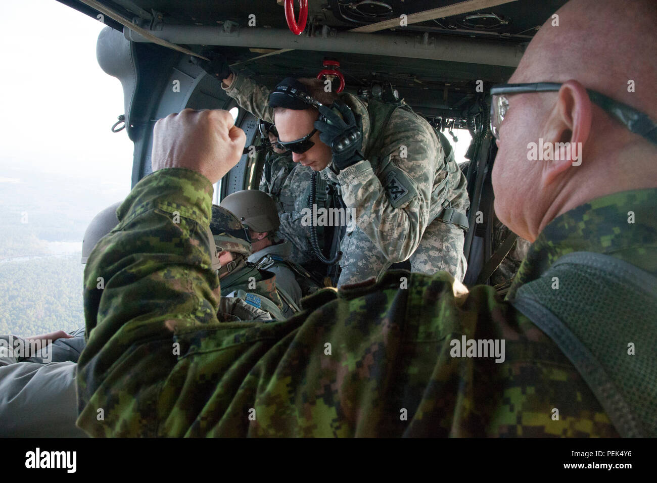 Canadian Armed Forces Sgt. Joe Hillier, a jumpmaster, conducts an ...