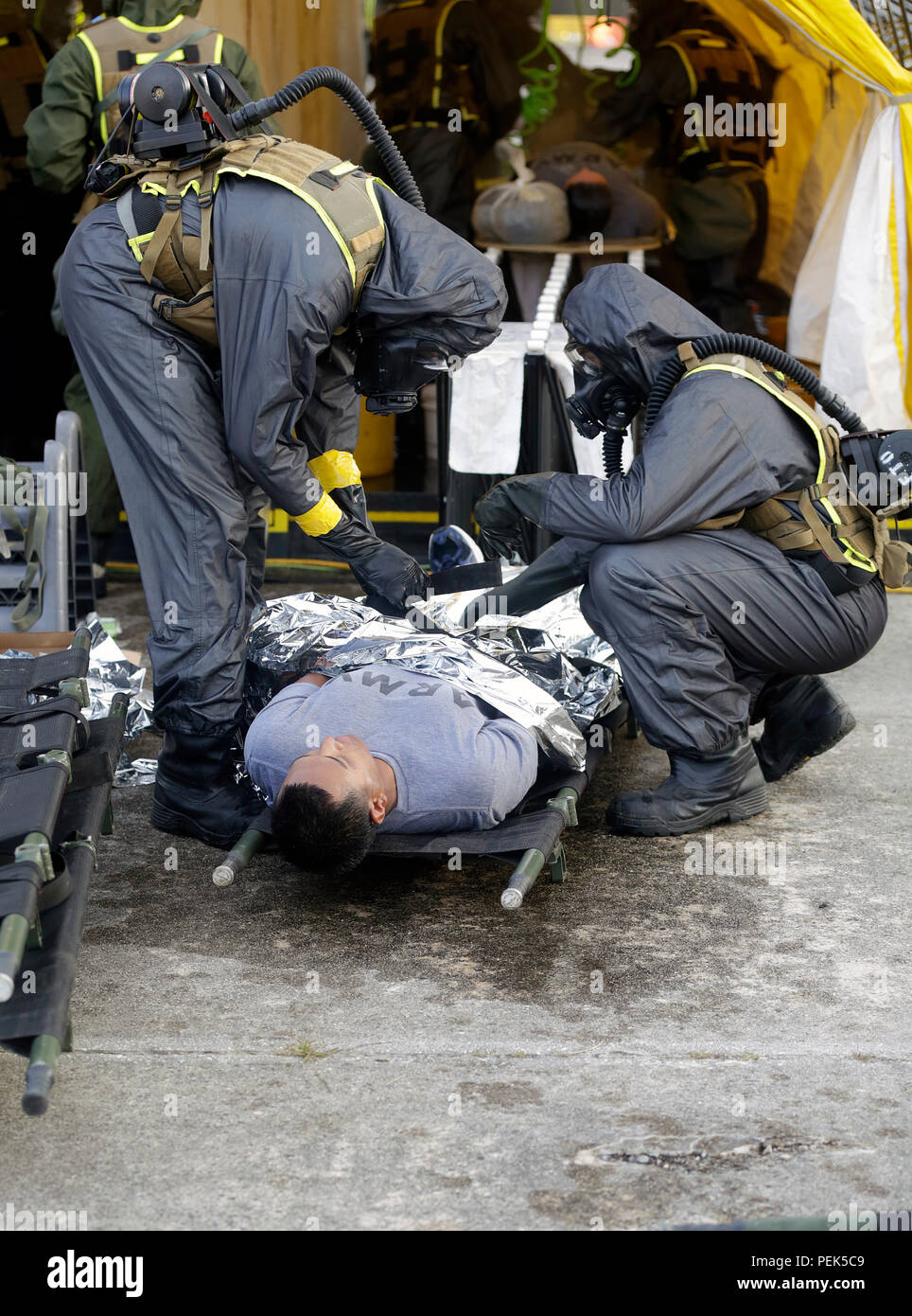 A role player goes through the mass casualty decontamination line and ...