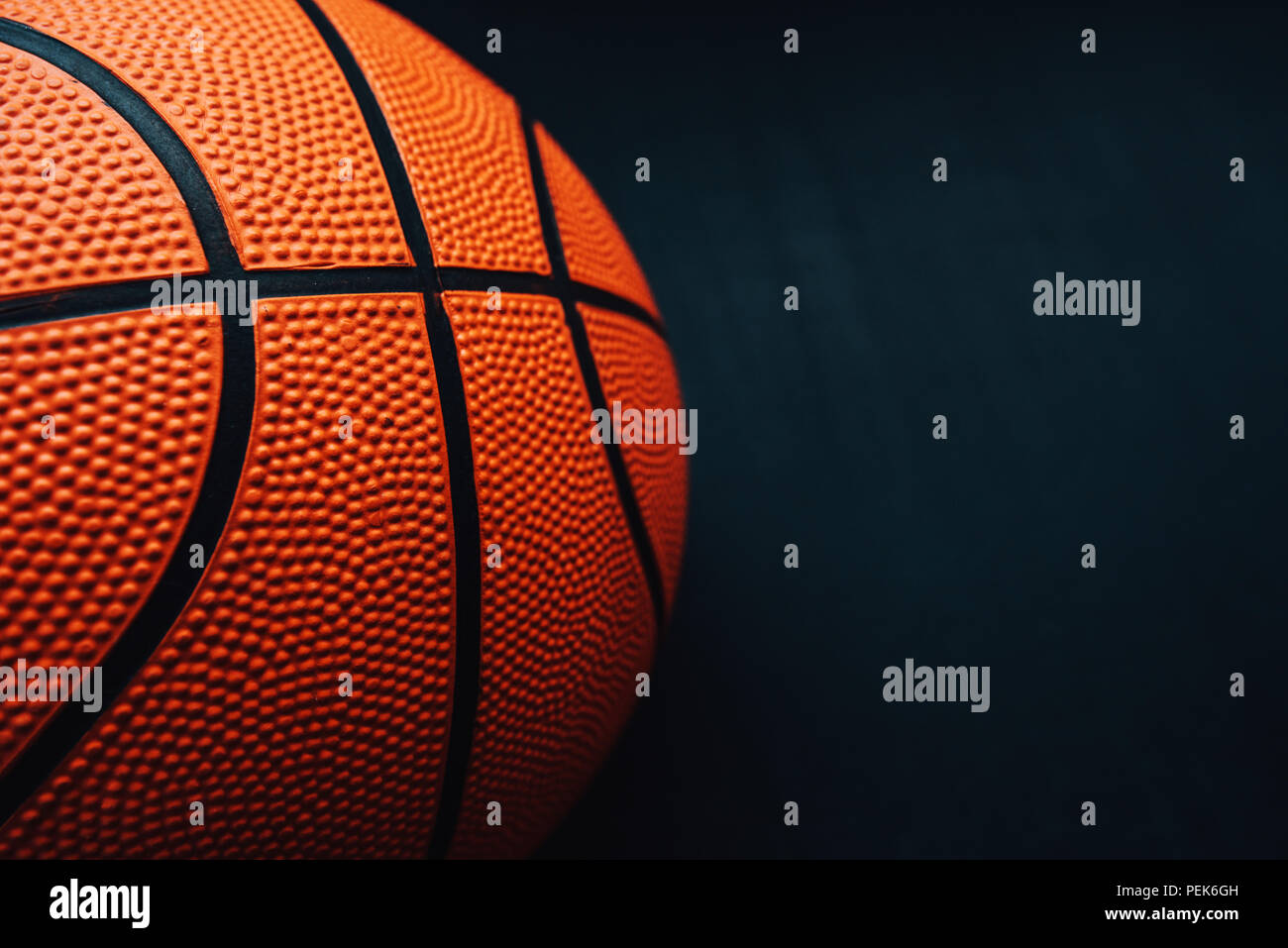 Basketball on dark background, copy space included Stock Photo - Alamy